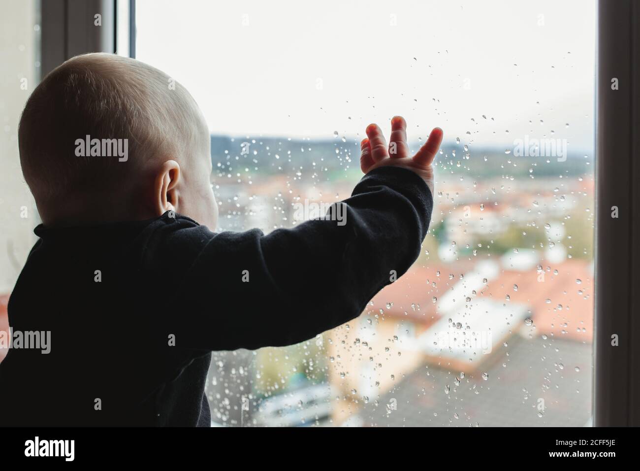 Child window sad back hi-res stock photography and images - Alamy