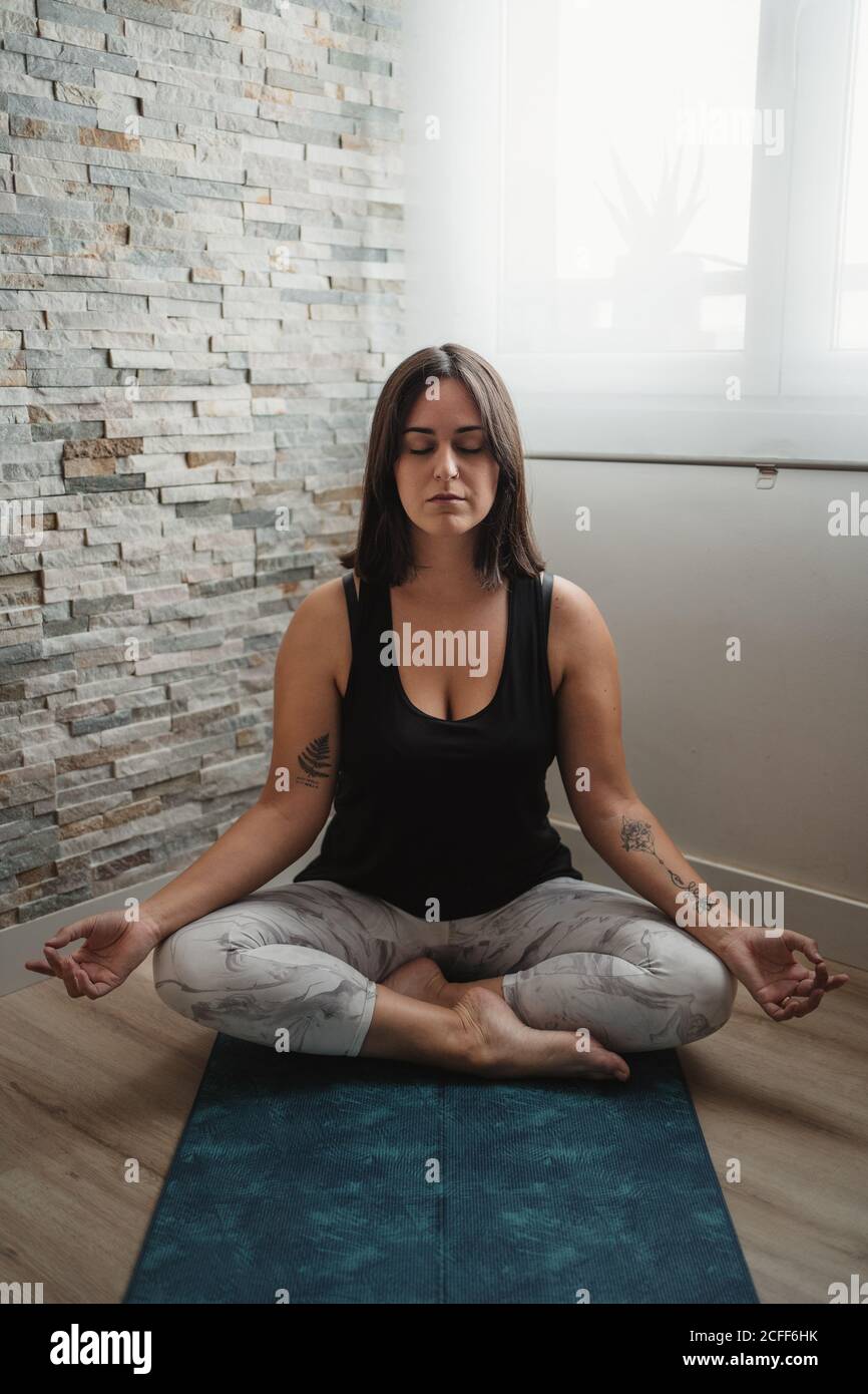 Woman in lotus pose hi-res stock photography and images - Alamy