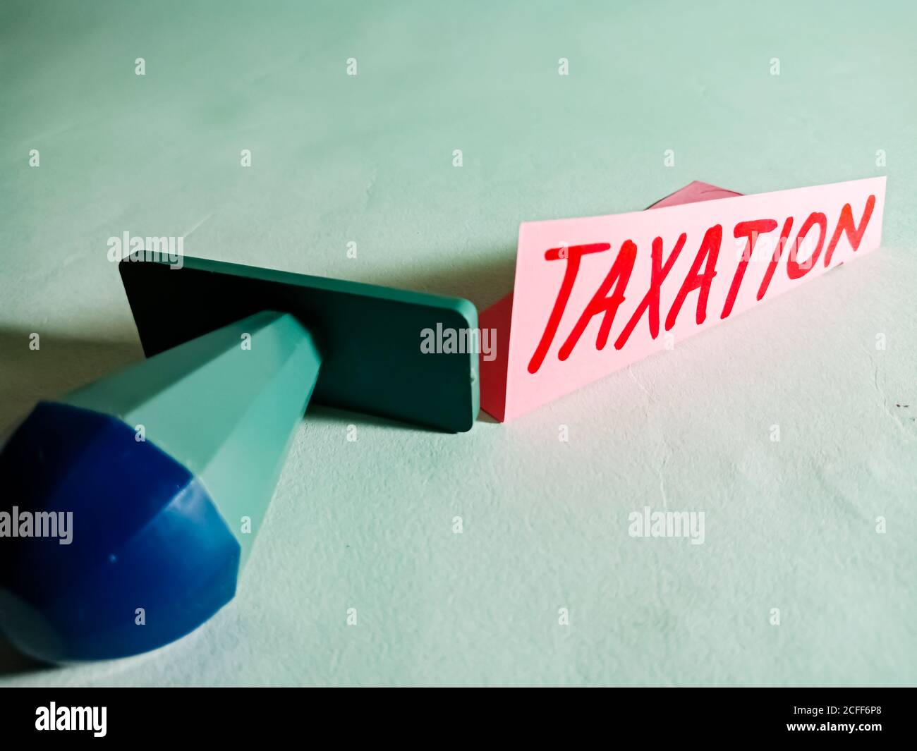 Taxation word displayed on paper slip concept for educational ...