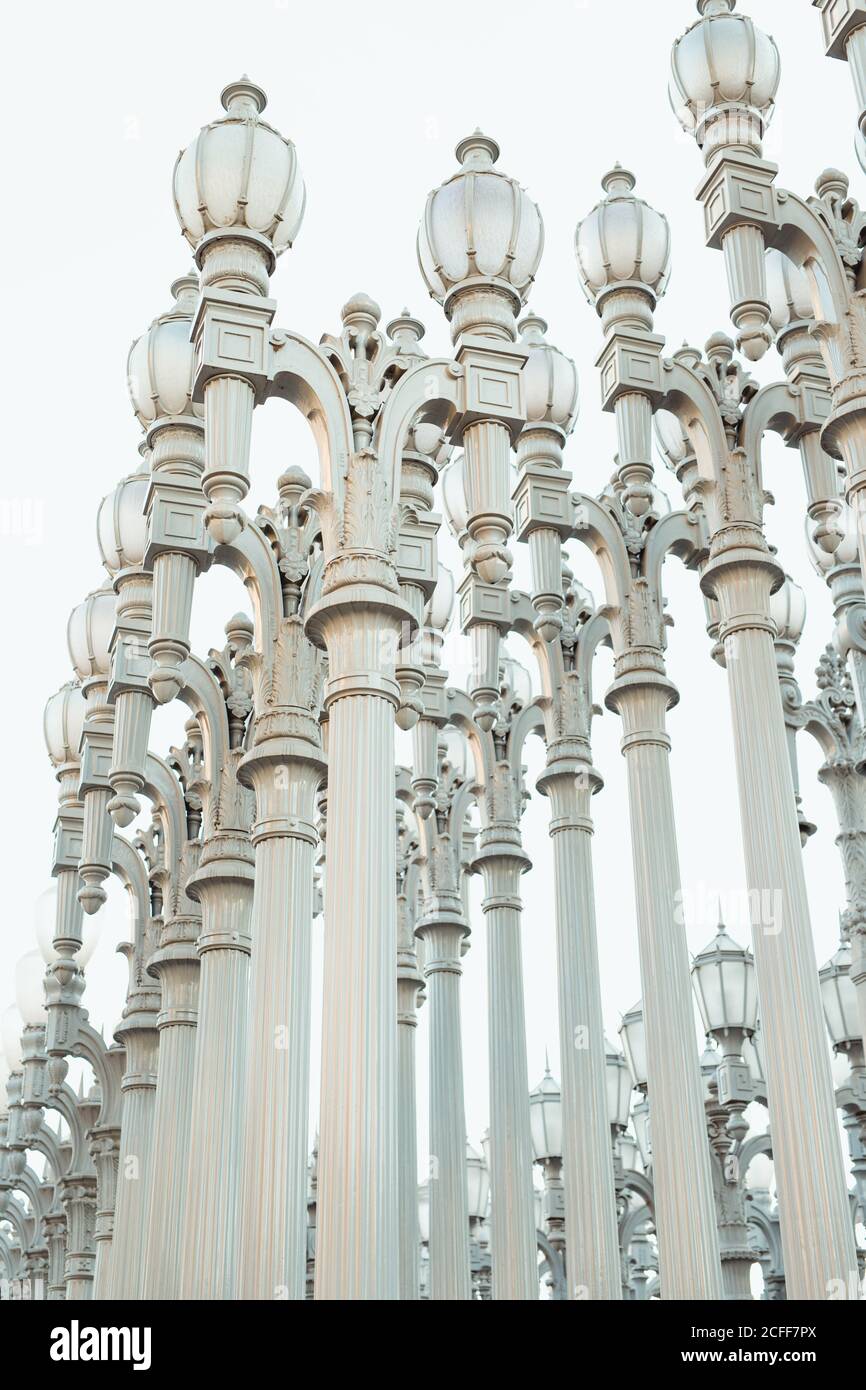 row with high silver column lantern and touching hair in Los Angeles ...