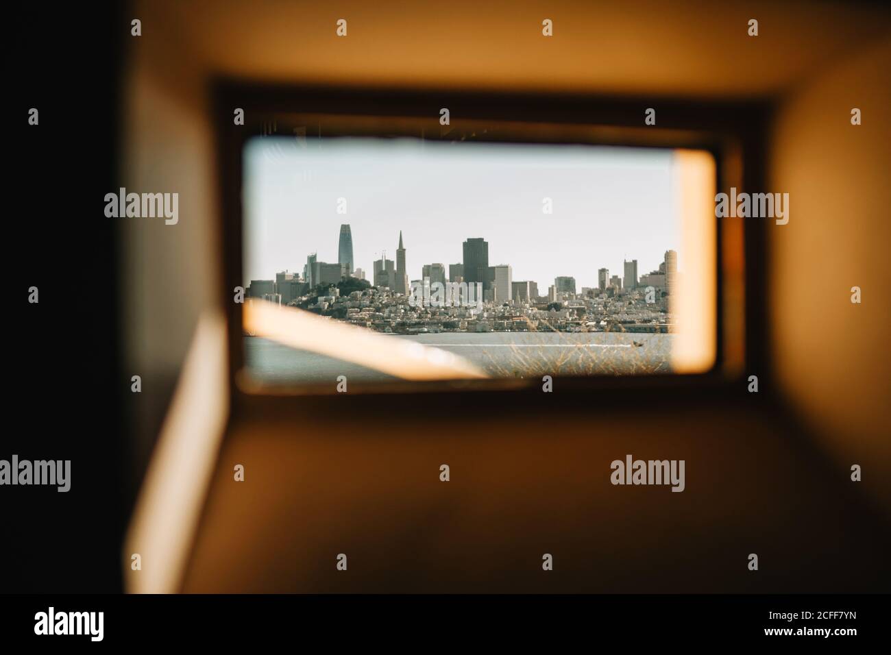 View of modern city through small window in Venice beach on sunny day ...