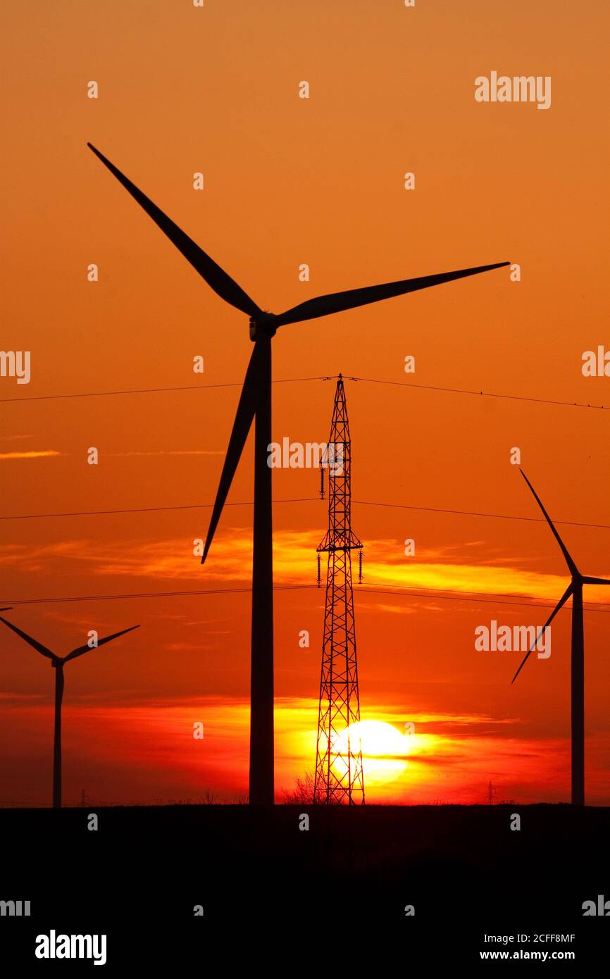 Wind turbines sunset blades hi-res stock photography and images - Alamy
