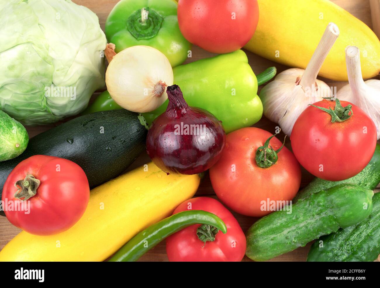 Washed fresh vegetables in large quantities on a white background with ...