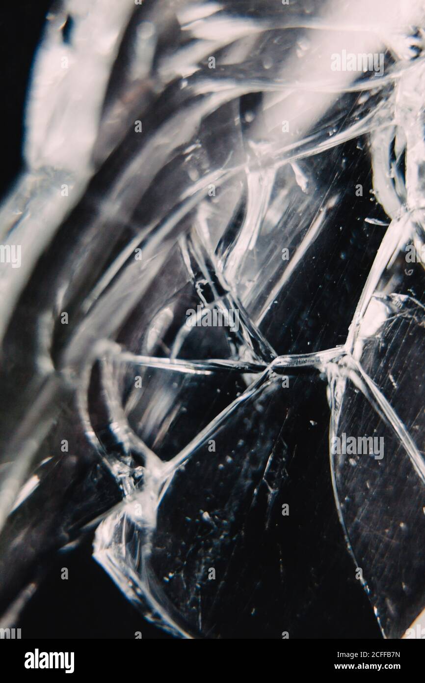 Abstract background with shiny pieces of broken transparent glass on ...