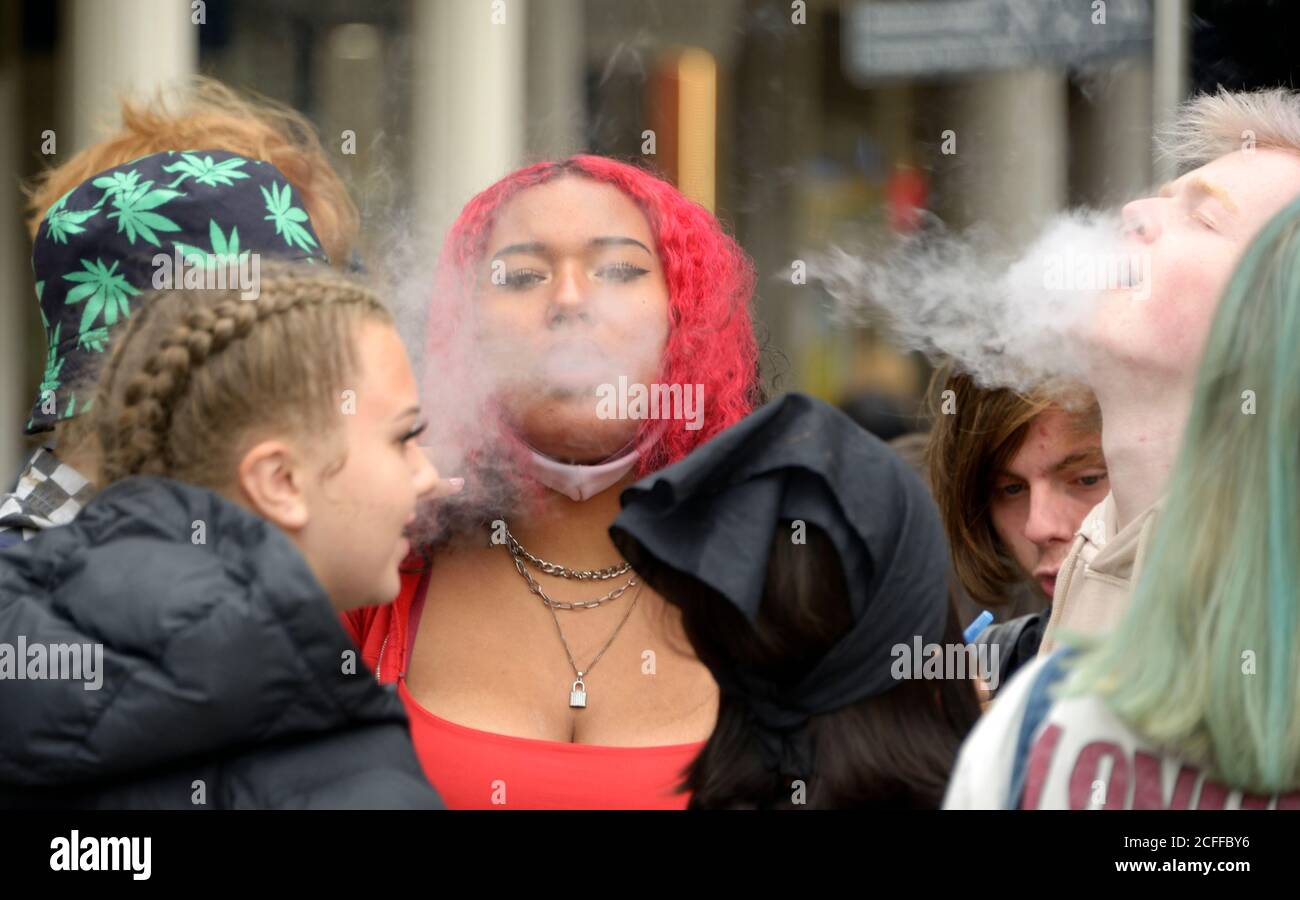 Young women vaping, at Socialist protest Stock Photo - Alamy