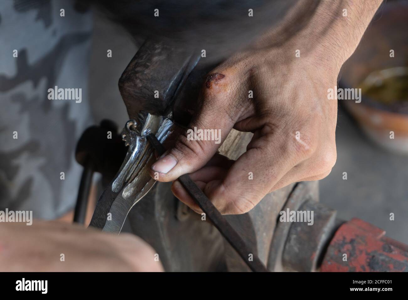 making traditional Balinese keris manually. The process of carving ...