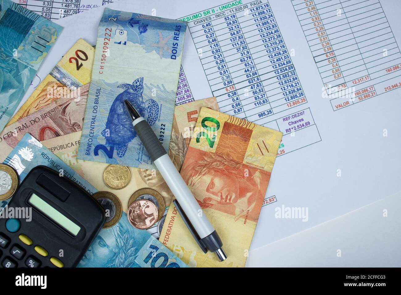 Brazilian money with calculator and numerical chart background Stock ...