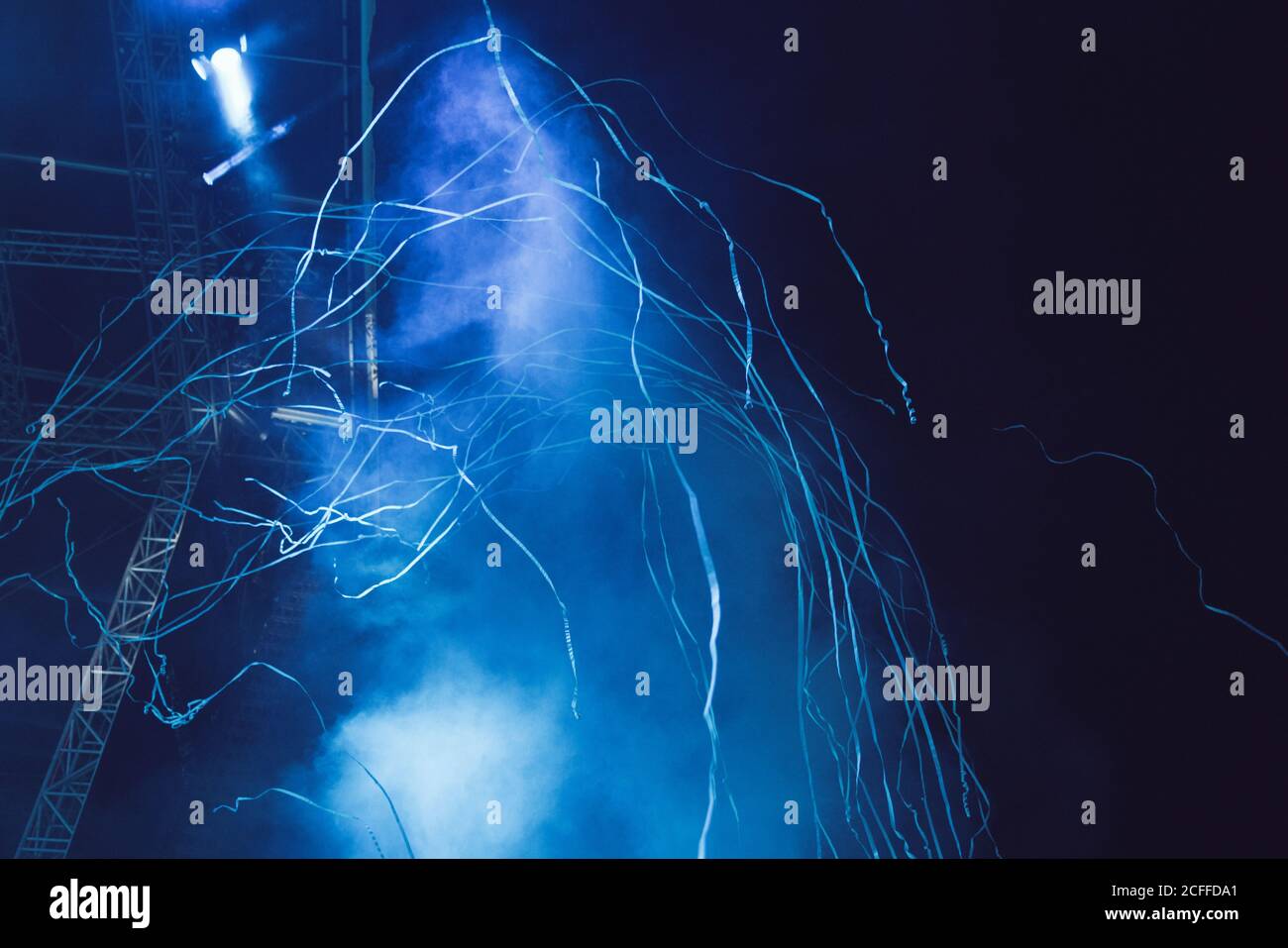 From below fragment of metal stage installation with flying ribbons and ...