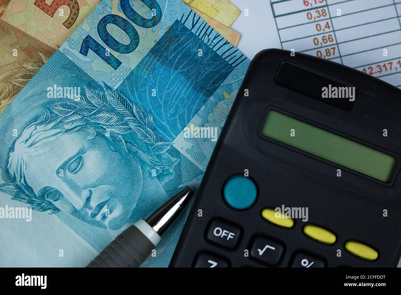 Brazilian money with calculator and numerical chart background Stock ...