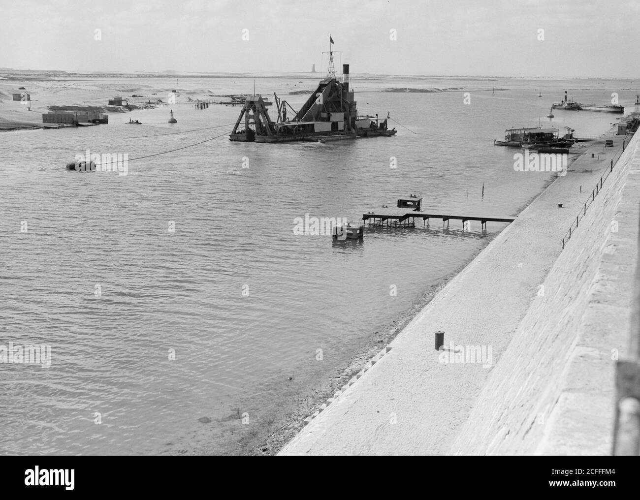 Original Caption: Egypt. Isma'lia. The canal showing the dredger ...