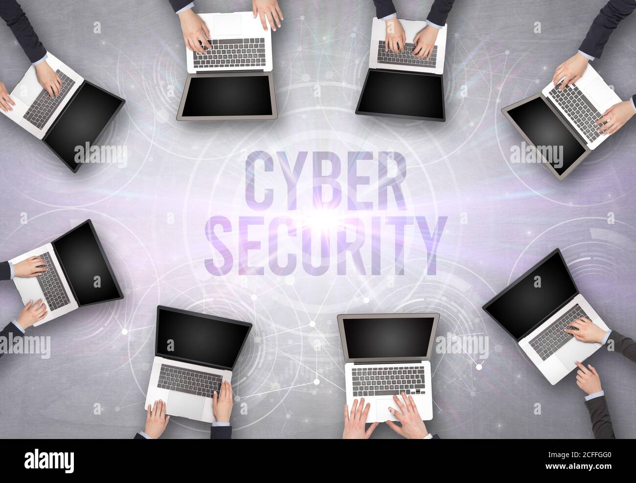 Group of people in front of a laptop with CYBER SECURITY insciption ...