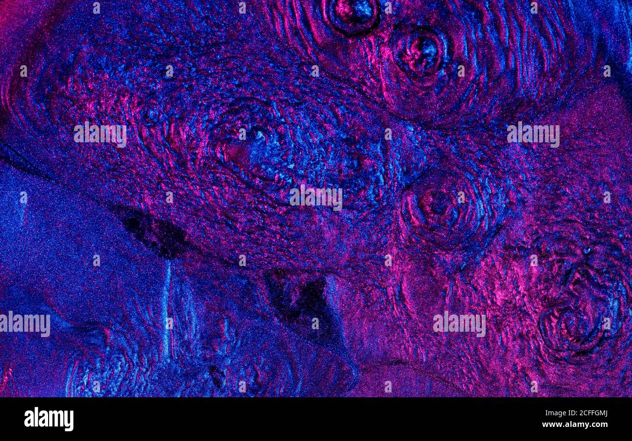 Ferrofluid illuminated with neon light Stock Photo - Alamy