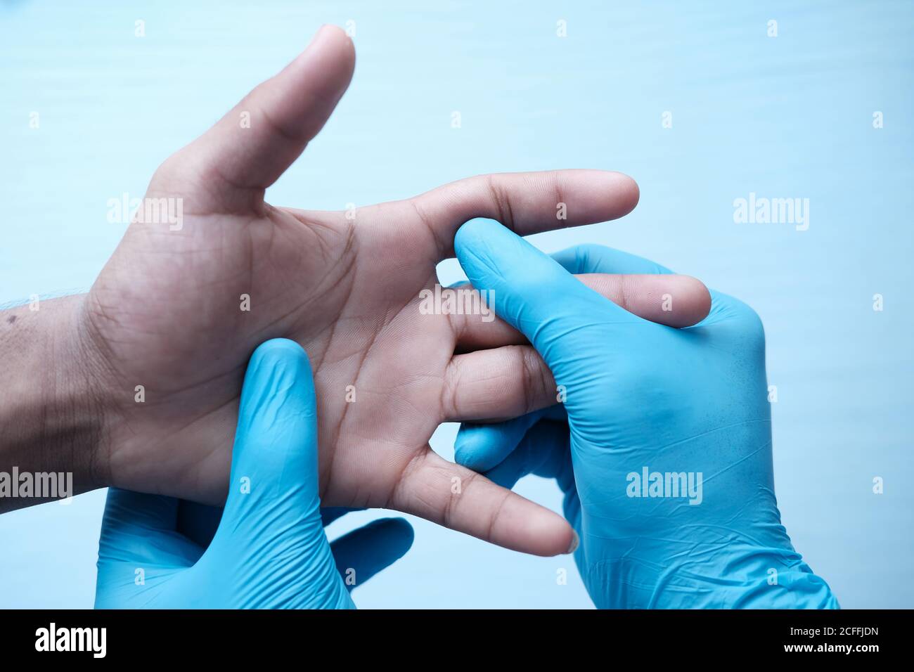 Top view of male doctor holding a patients hand Stock Photo - Alamy