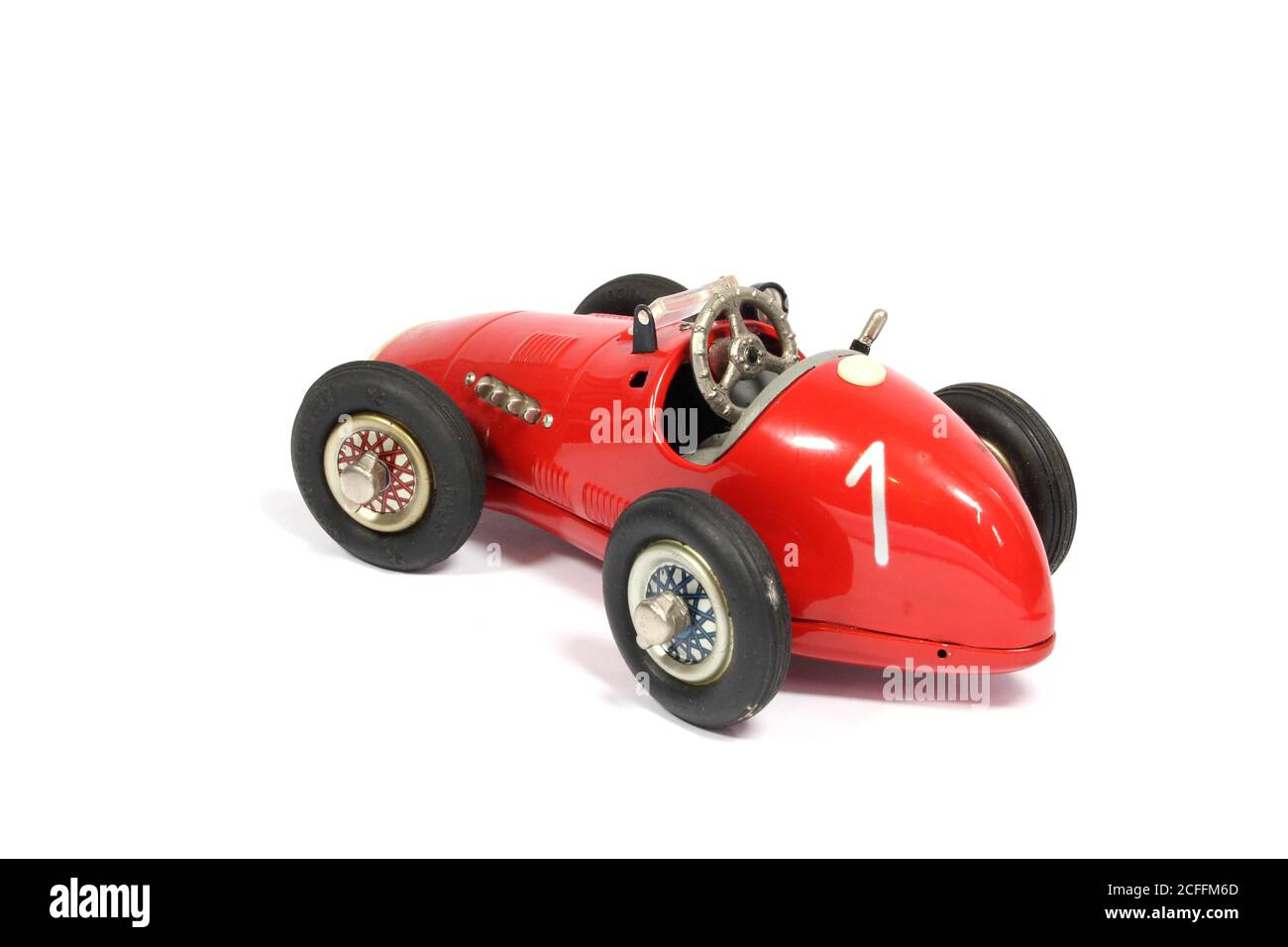 A Vintage Classic Toy Tin Racing Car On White background Stock Photo ...