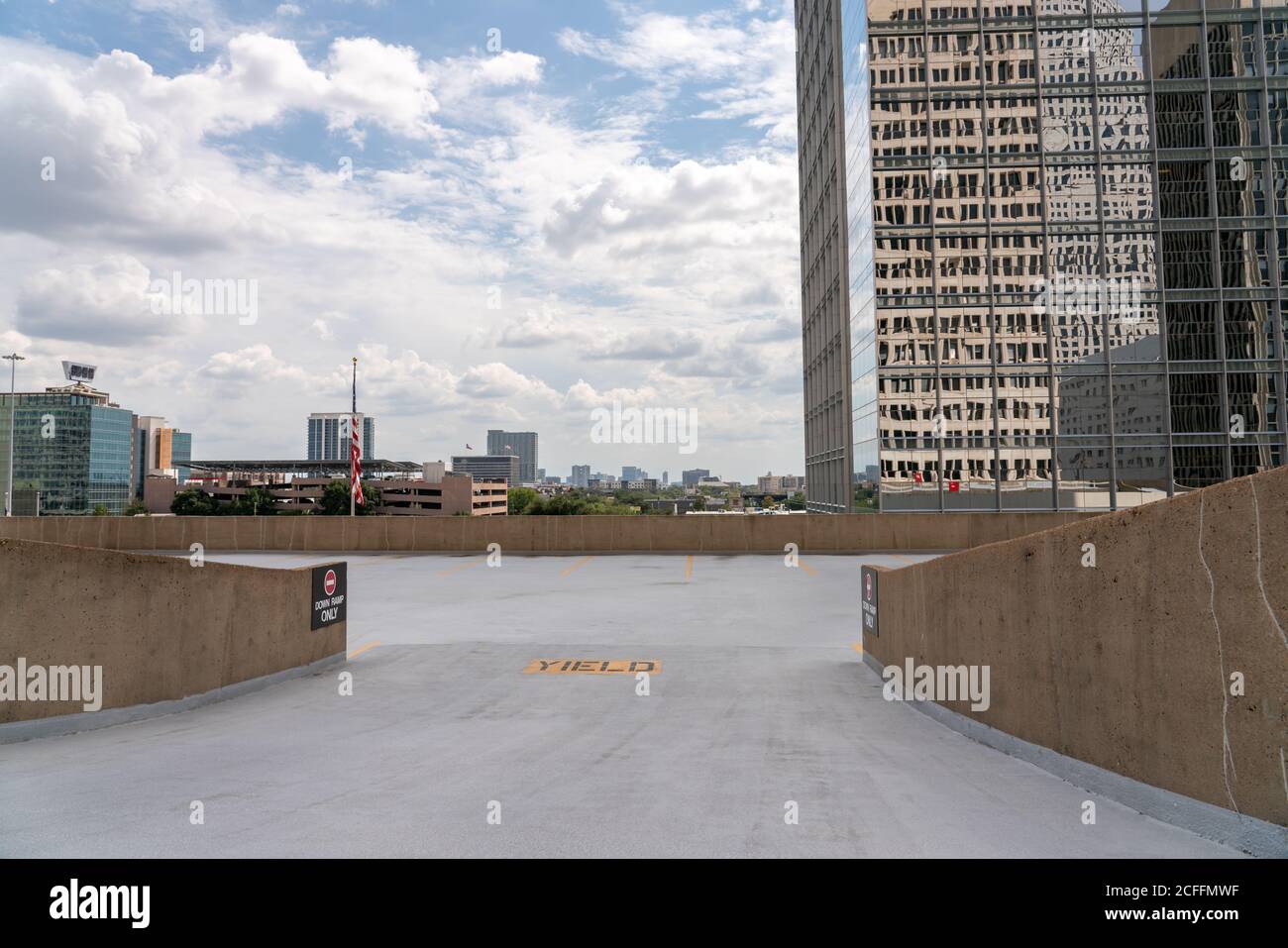 Driving Down Ramp on Roottop Parking With Houston Skyline in the ...