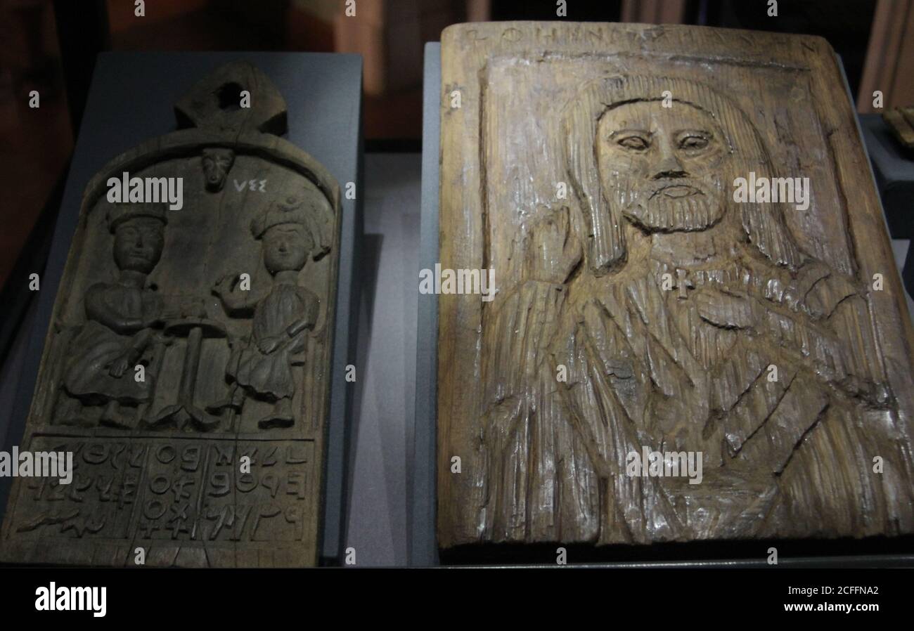 Ancient wooden tablets depicting early religious and Christian symbols ...