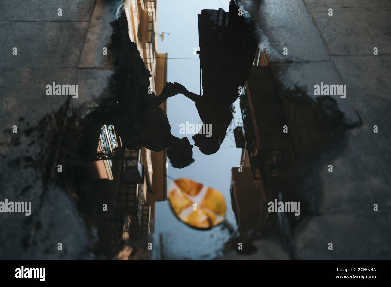 Couple water puddle reflection hi-res stock photography and images - Alamy