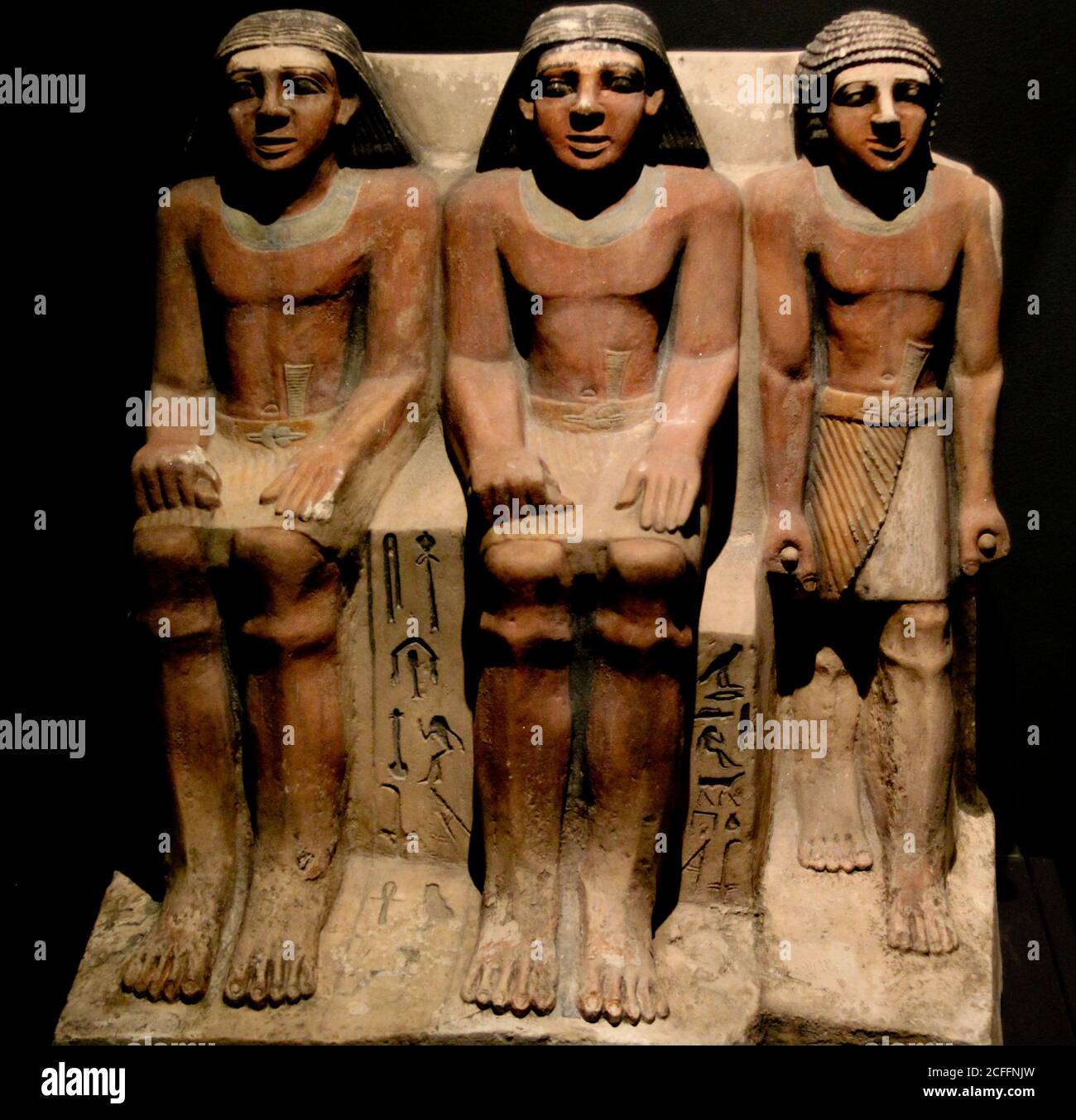 Egyptian artifact depicting a pharaoh a queen and scribe or manservant ...