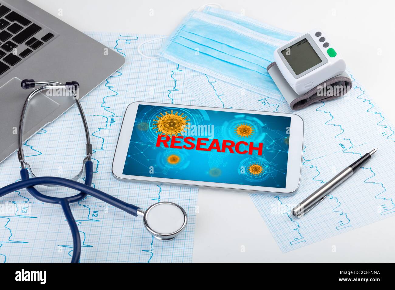 Close-up view of a tablet pc with RESEARCH inscription, microbiology ...
