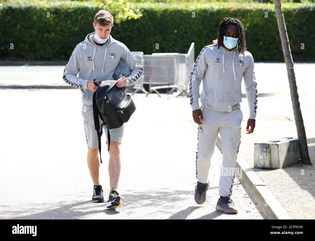 Coventry City’s Ben Sheaf (left) and Frankly Dabo (right) arrives ahead ...