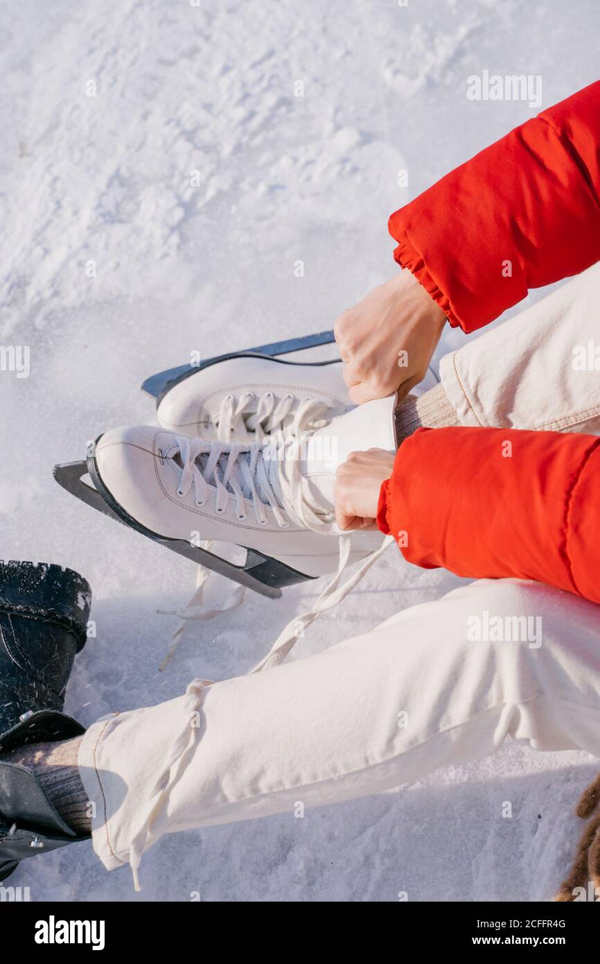 Woman putting on boots hi-res stock photography and images - Alamy