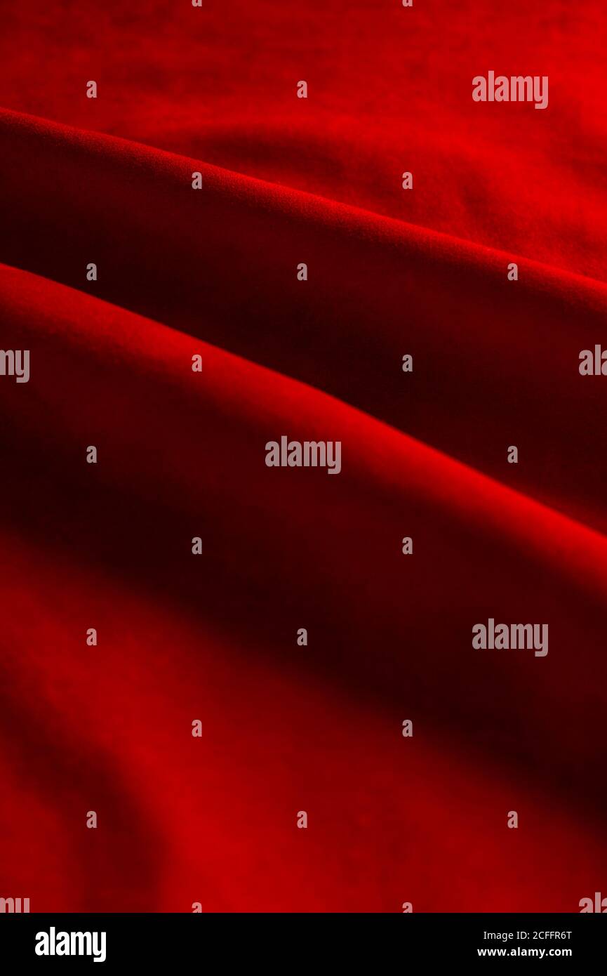 Dark red matte background of suede fabric, closeup. Velvet texture of ...