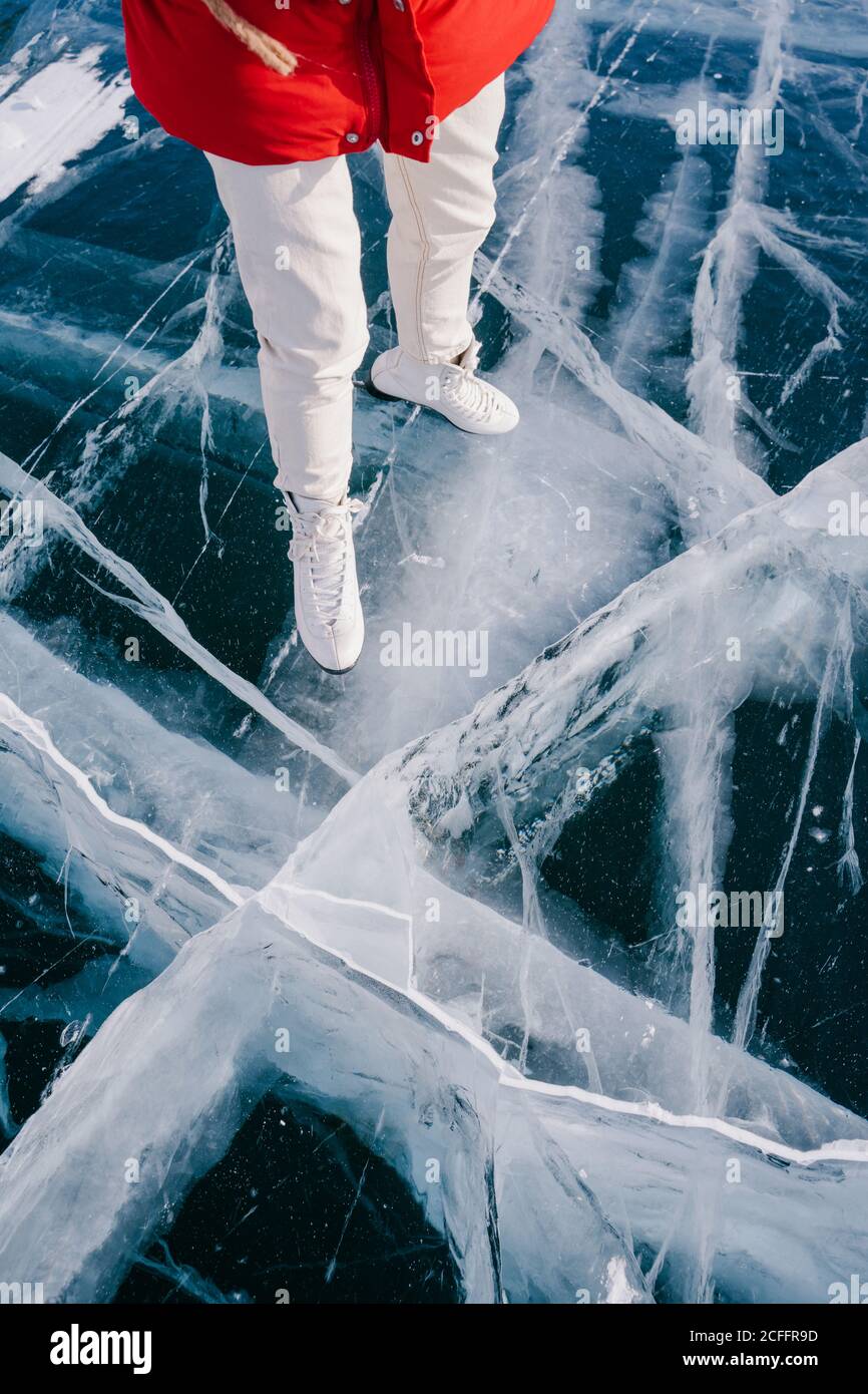 Woman skating on frozen river Stock Photo - Alamy