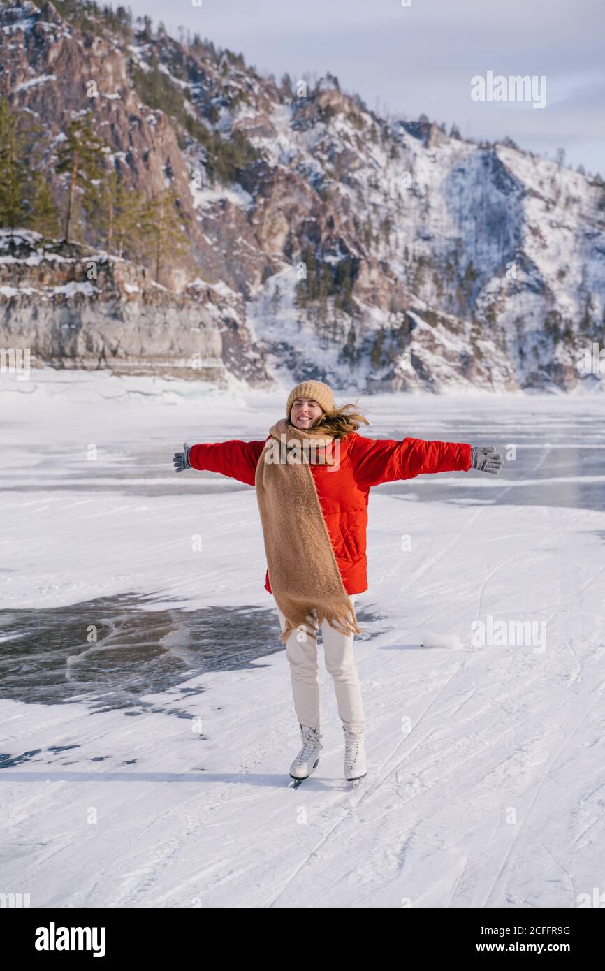 Woman skating on frozen river Stock Photo - Alamy