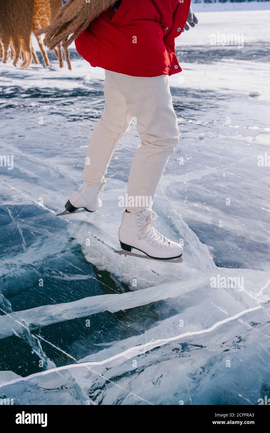 Woman skating on frozen river Stock Photo - Alamy