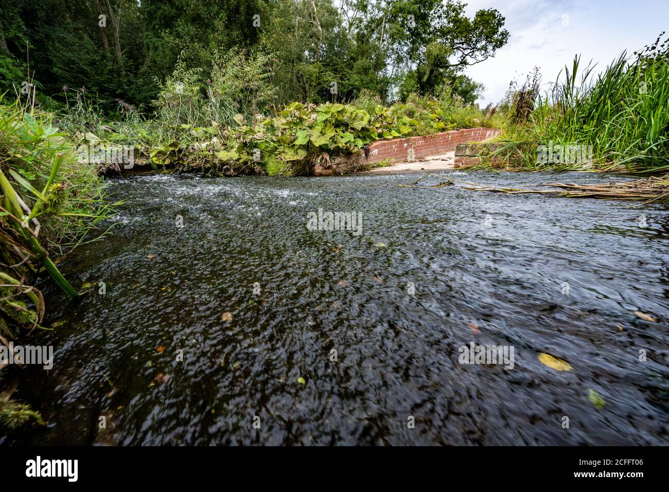 Low-level image of canal water running off into a spillway overflow on ...