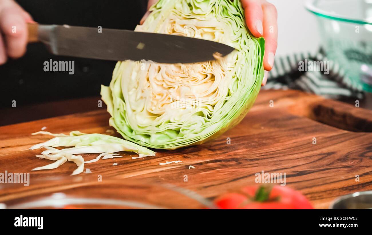 Step by step. Shredding green cabbage for beet soup, borscht Stock ...
