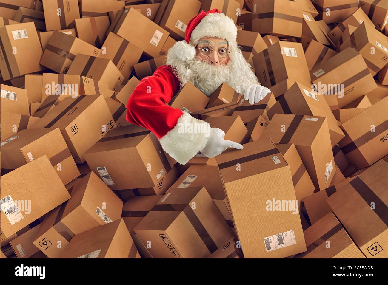Santa Claus is full of presents and boxes to delivery Stock Photo - Alamy