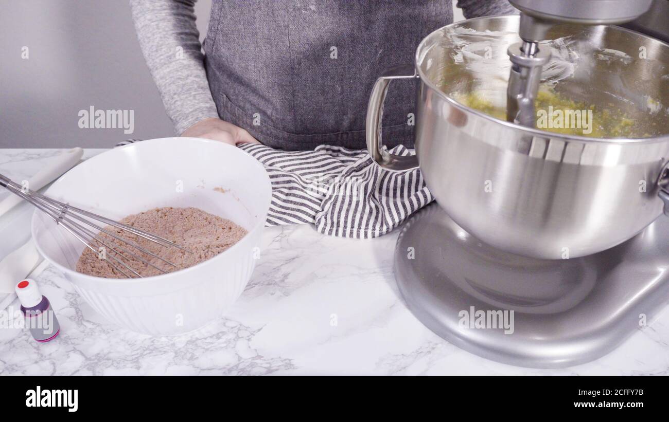 Step by step. Mixing ingredients in a standing kitchen mixer to bake ...