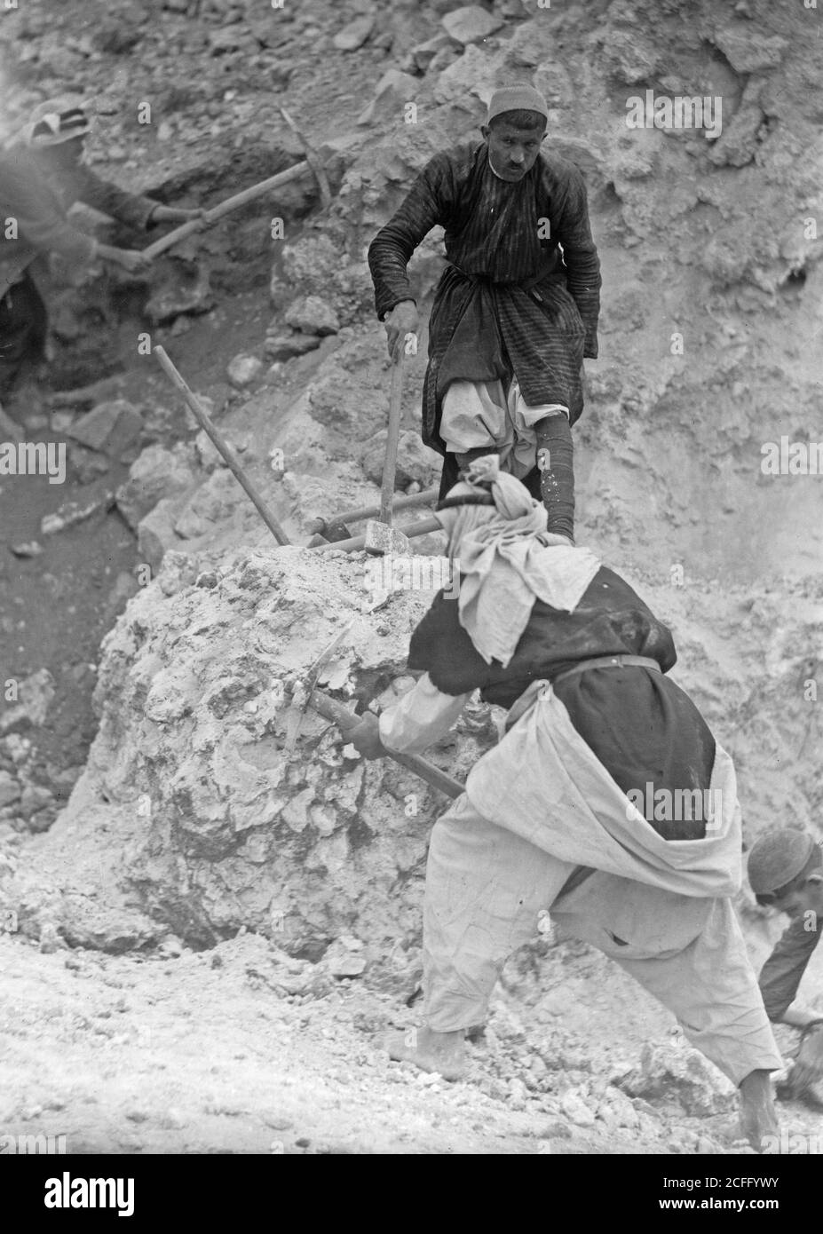 Middle East History - Tel Deweir (Lachish). Men clearing burnt line ...