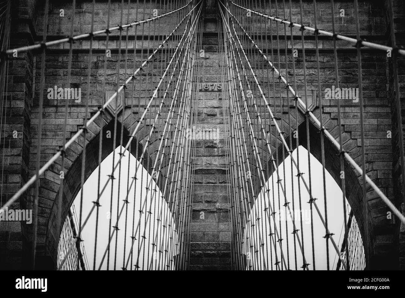 Low angle of stone towers with pointed arches of suspension Brooklyn ...