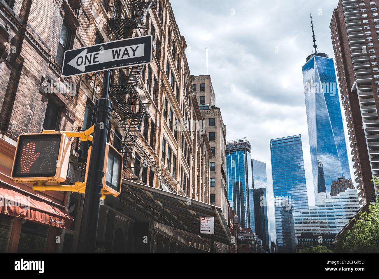 Low angle of contemporary skylines with glass facades and traffic sign ...