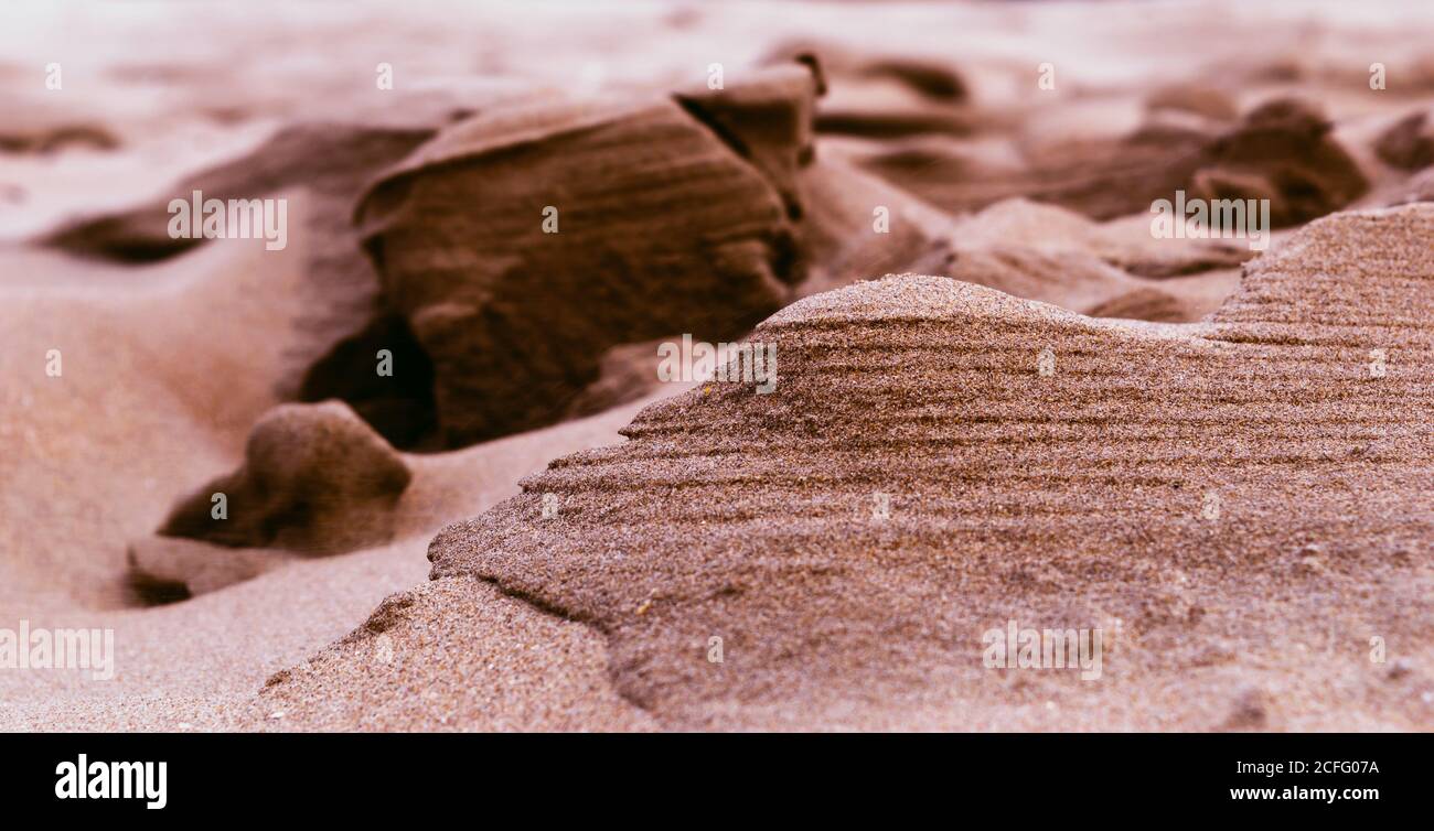 Close-up of sand shaped by water and wind Stock Photo - Alamy