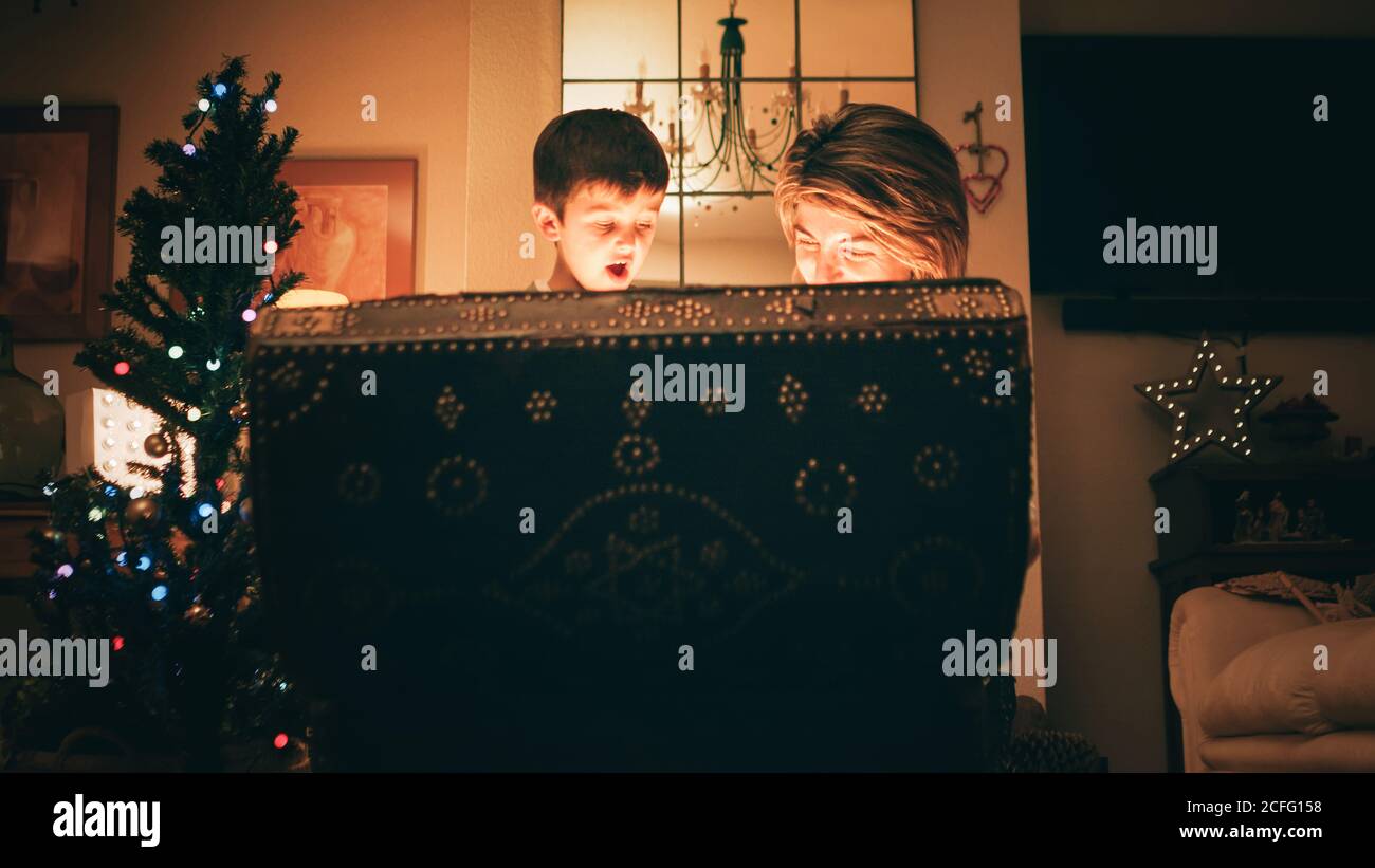 Mother and son opening magic chest on Christmas Day Stock Photo - Alamy