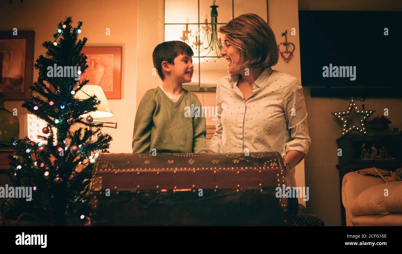 Mother and son opening magic chest on Christmas Day Stock Photo - Alamy