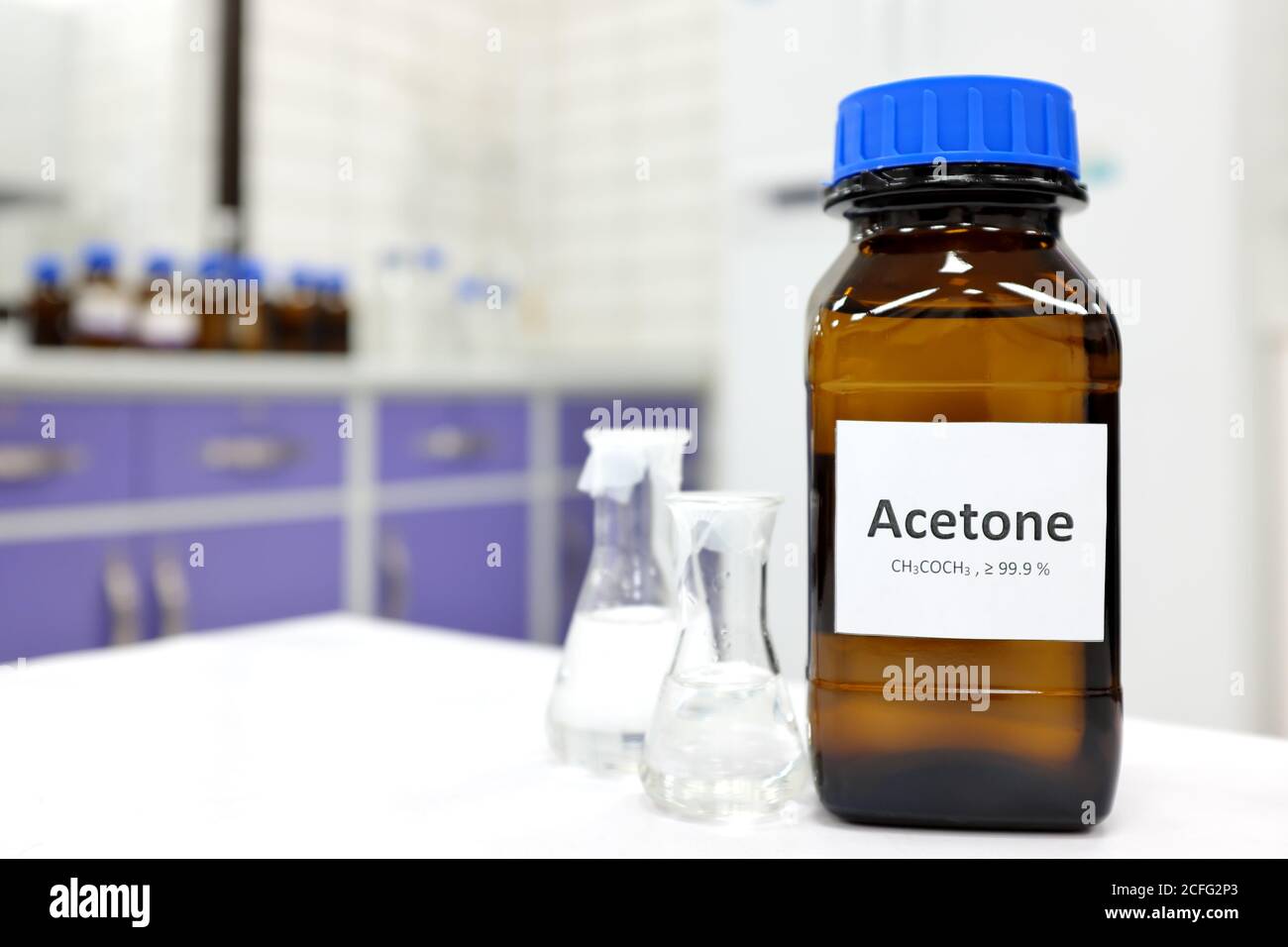Selective focus of pure acetone solution in brown glass amber bottle ...