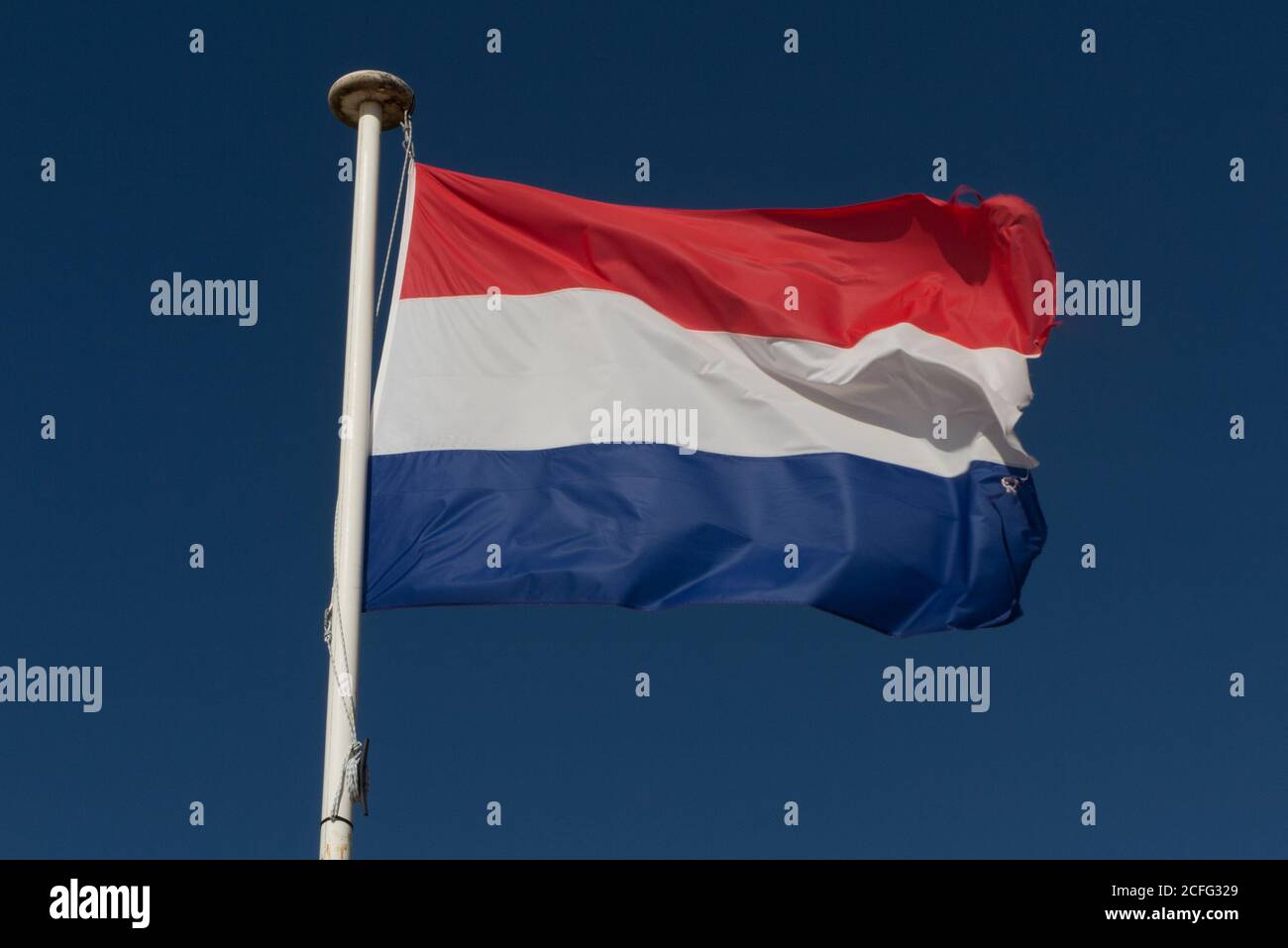French flag in front of blue sky - French national flag on wind lighted ...