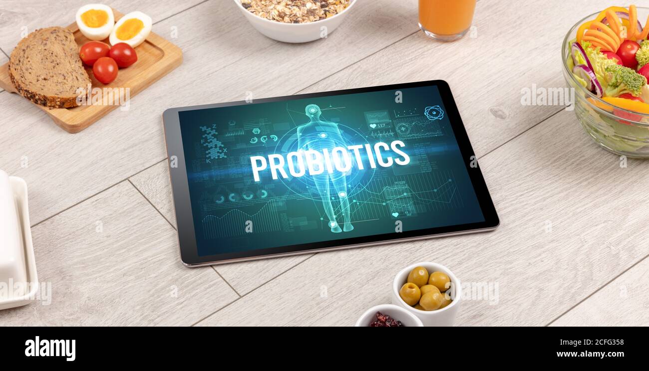 PROBIOTICS concept in tablet with fruits, top view Stock Photo - Alamy
