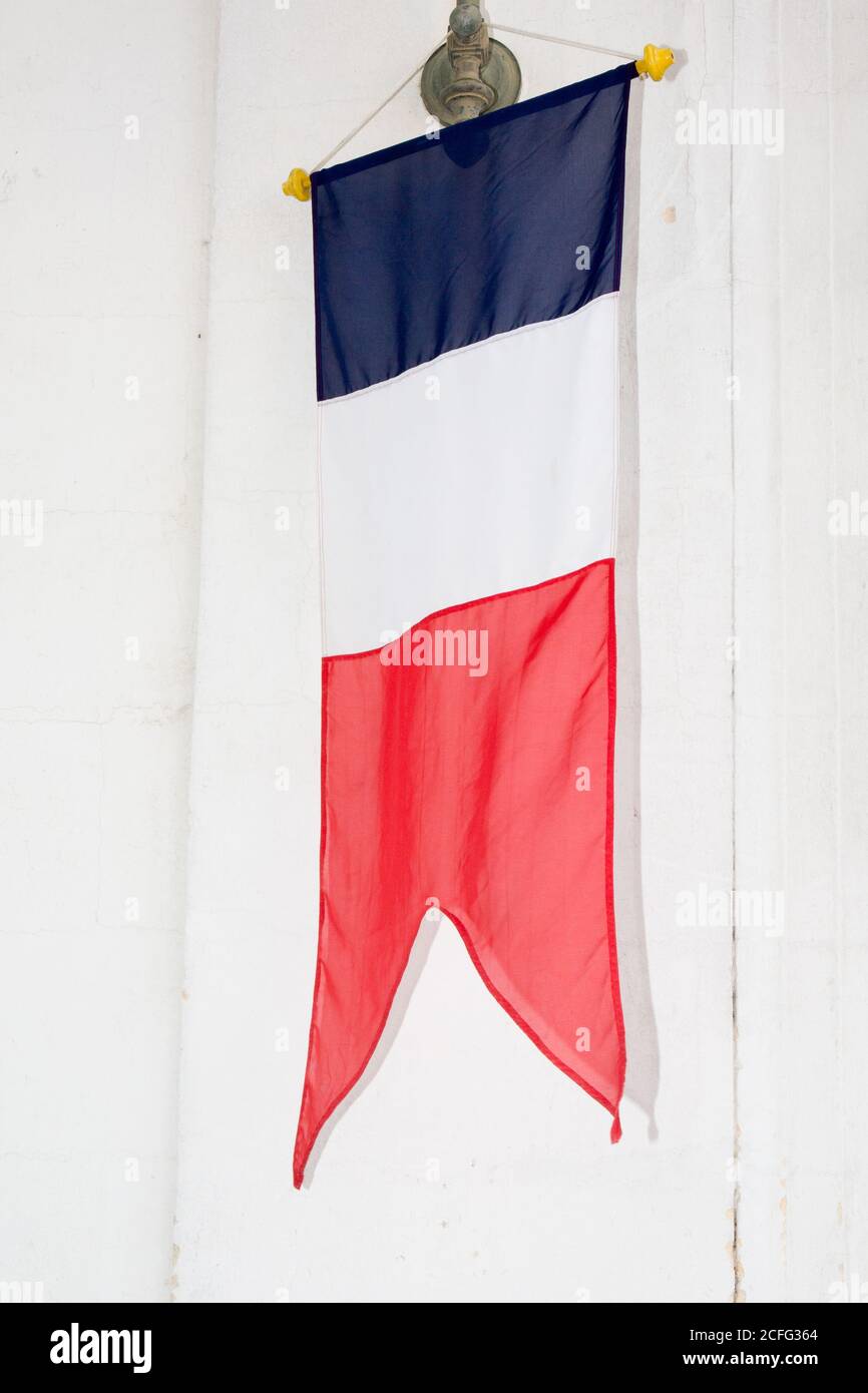 French flag near a wood wall outdoors Stock Photo - Alamy