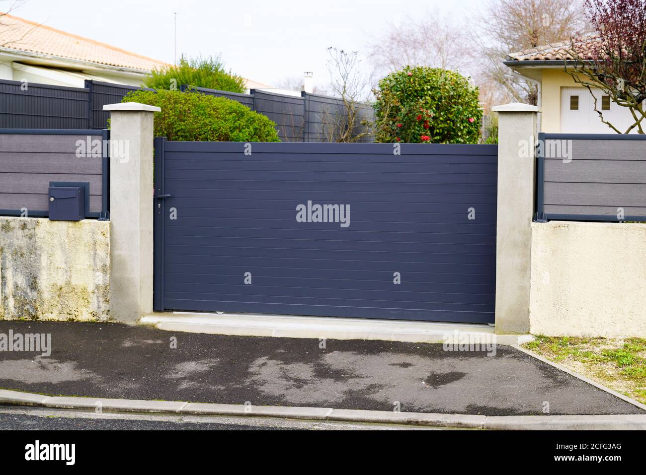 Aluminum grey metal gate of suburb house Stock Photo - Alamy