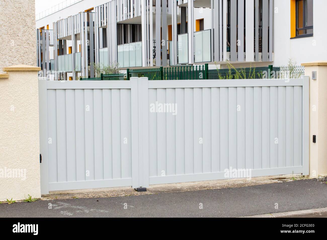 metal gate white grey home fence on suburb street house Stock Photo - Alamy