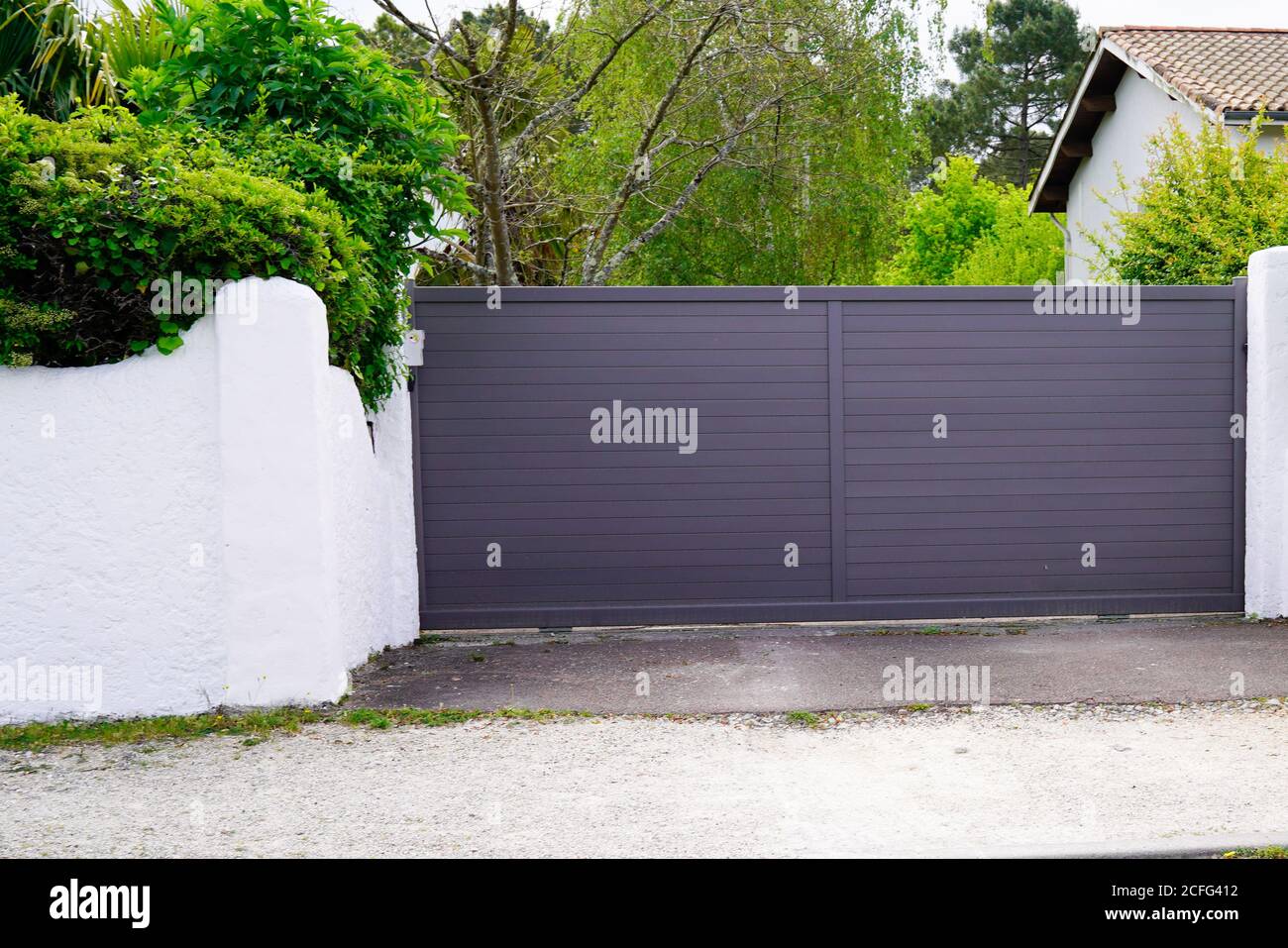 Aluminum grey metal gate house portal of suburb home Stock Photo - Alamy