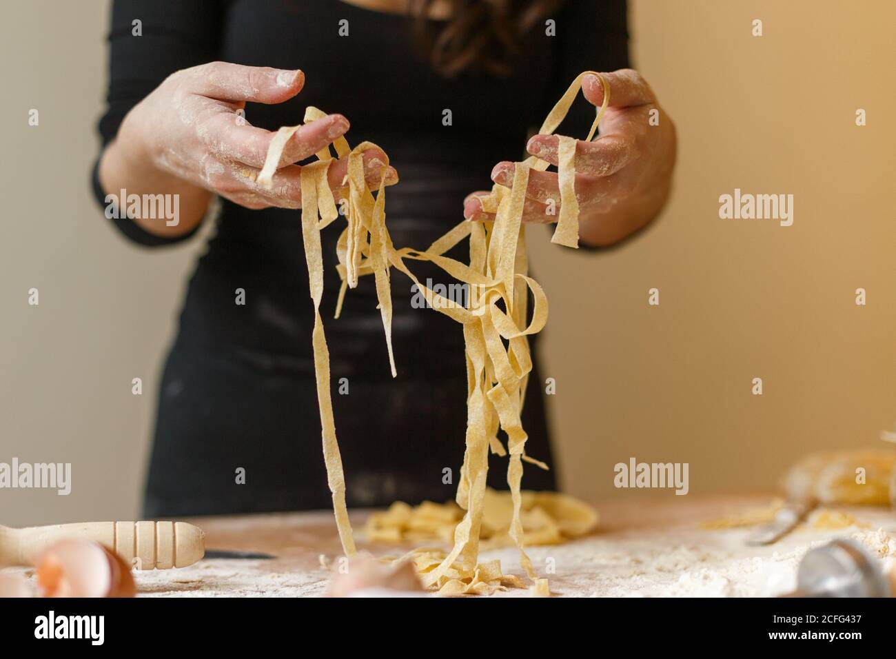 Hands rolling pasta hi-res stock photography and images - Alamy