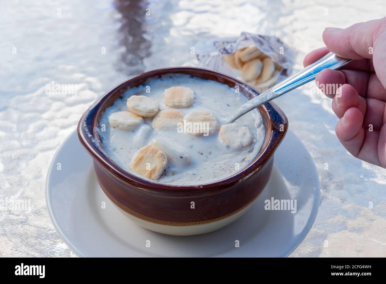 Photograph of a bowl of freshly made New England Clam Chowder with ...