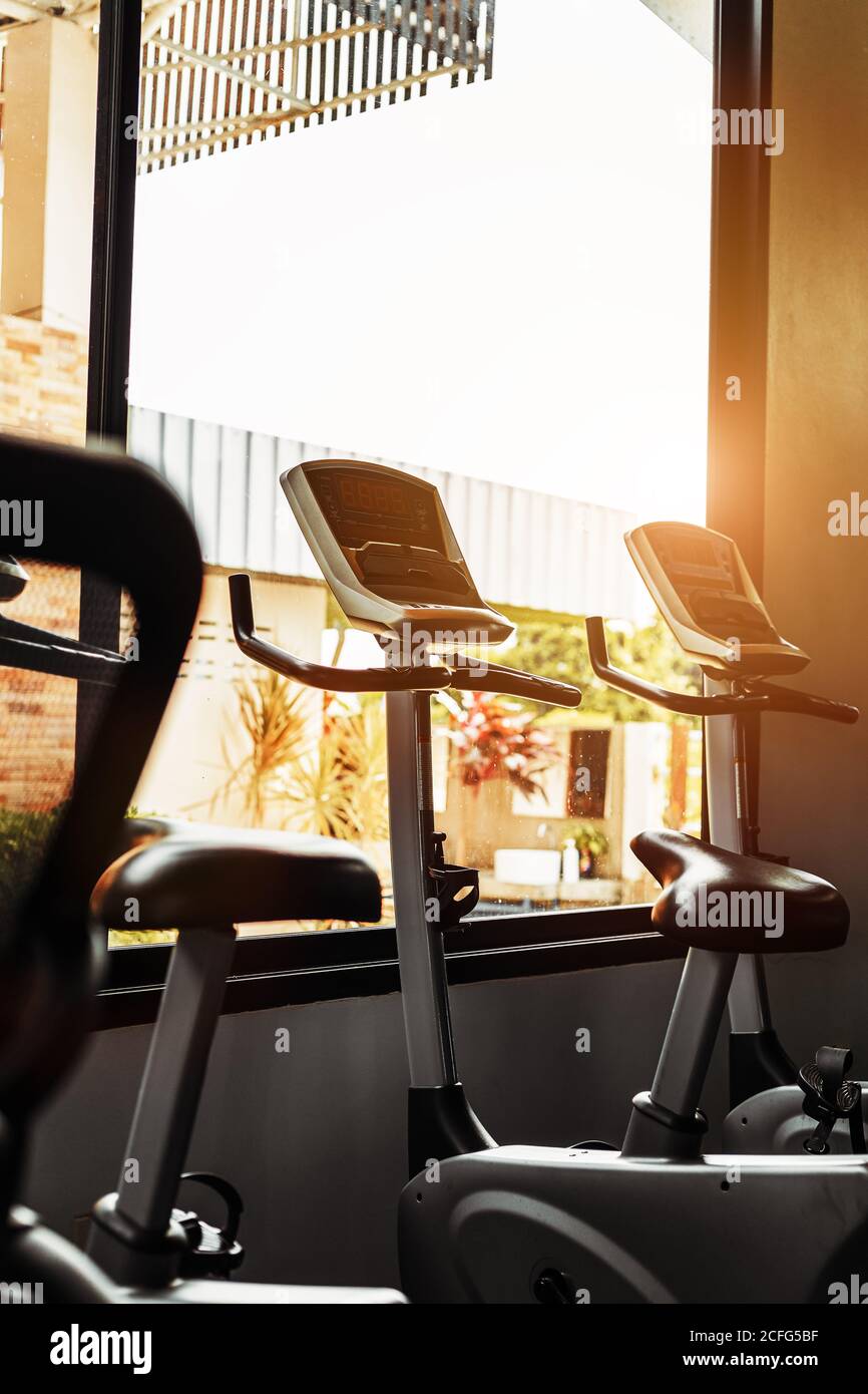 exercise bike near window at the fitness gym. Object Healthy and funny ...