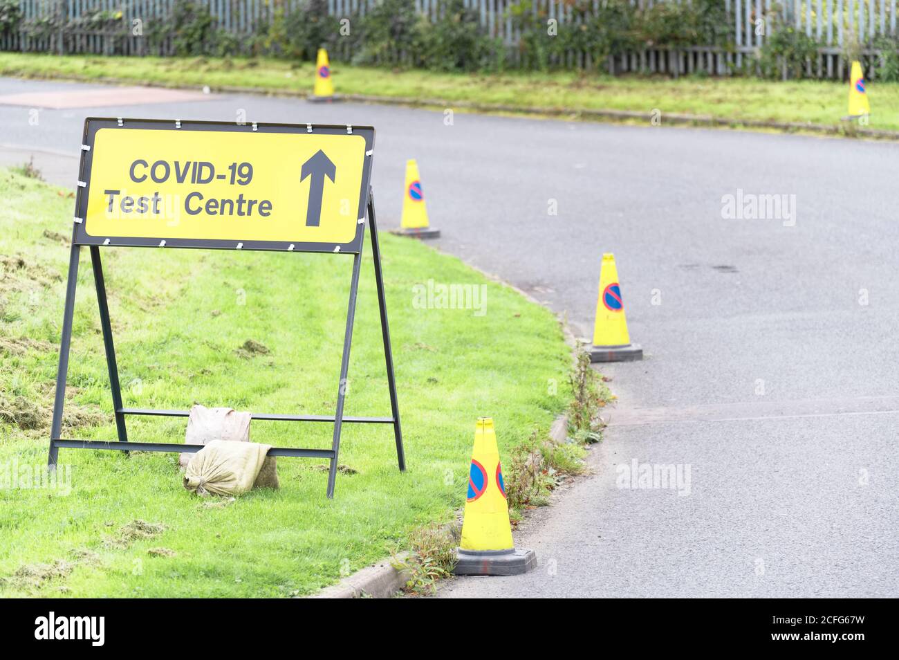 Covid-19 test centre sign at road with traffic cones Stock Photo - Alamy